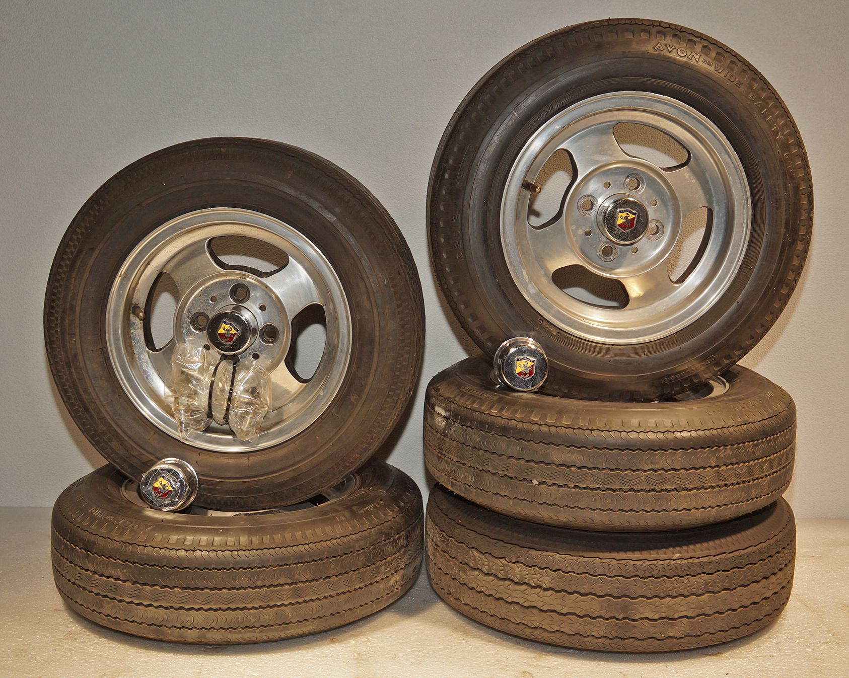 Bonhams Cars : A lot of five 12 inch aluminum 4-spoke wheels,
