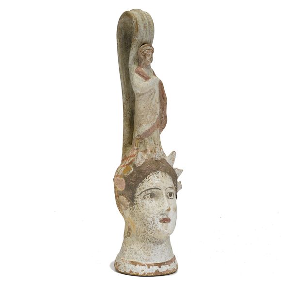 Bonhams : A terracotta paint decorated figural Canosan vase