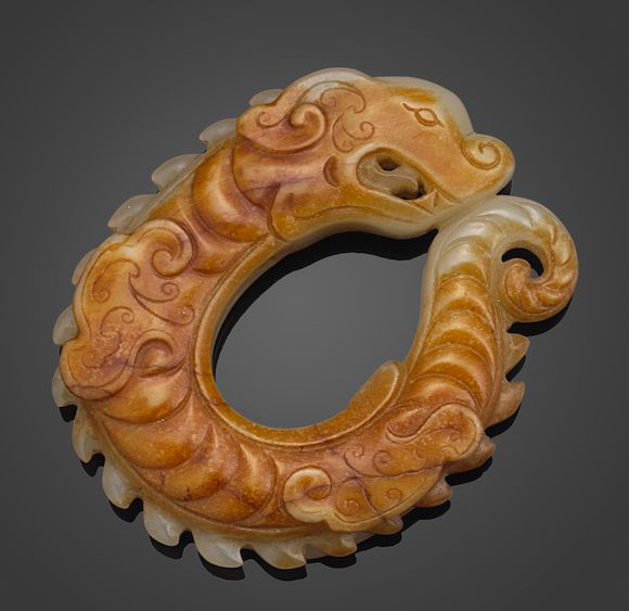 Bonhams : A rare archaistic jade dragon with russet skin 18th/19th century