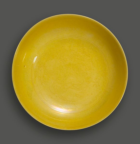 Bonhams : A yellow glazed dish with incised dragon decoration Daoguang ...