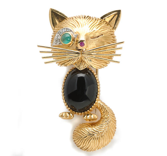 Bonhams : A black onyx, emerald, ruby and diamond winking cat brooch, Van Cleef & Arpels, French,