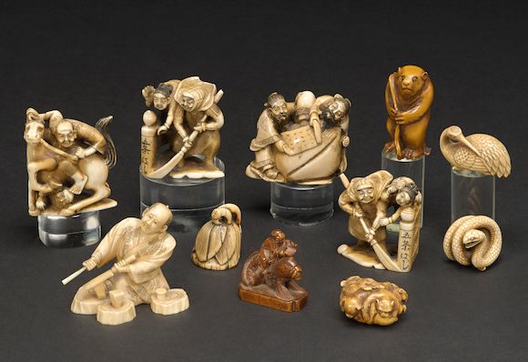 Bonhams : A group of ten small tinted ivory carvings