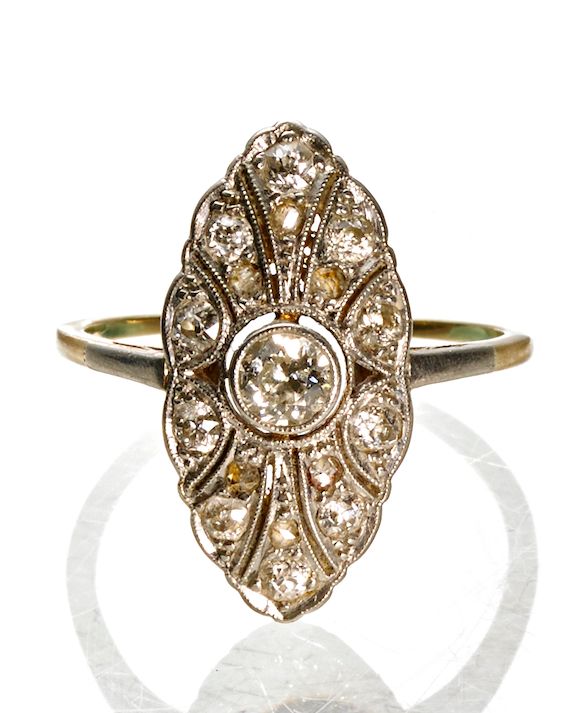 Bonhams : A belle époque diamond and platinum-topped 14k gold navette-shaped ring,