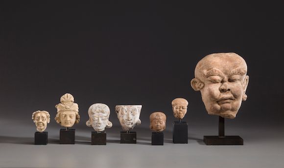 Bonhams : Seven terracotta heads Ancient region of Gandhara and Indonesia, 3rd-15th century