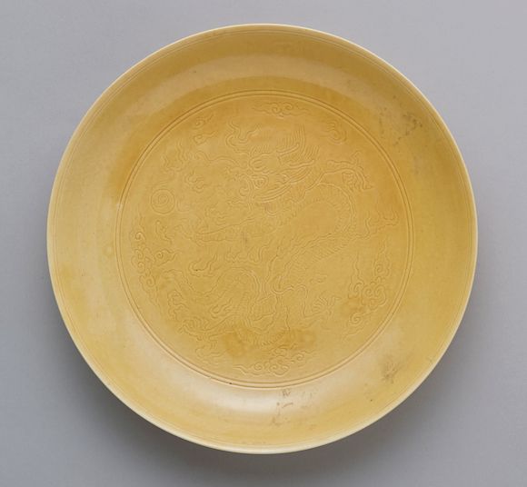 Bonhams : A yellow glazed dish with incised dragon decoration Daoguang ...
