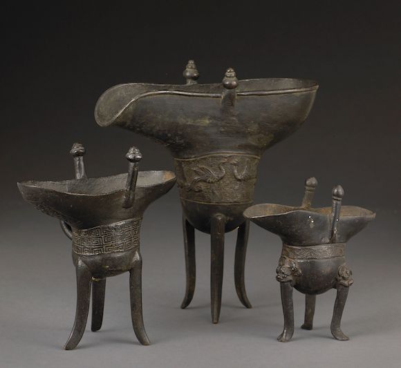 Bonhams : A group of three cast bronze libation vessels Ming/Qing dynasties