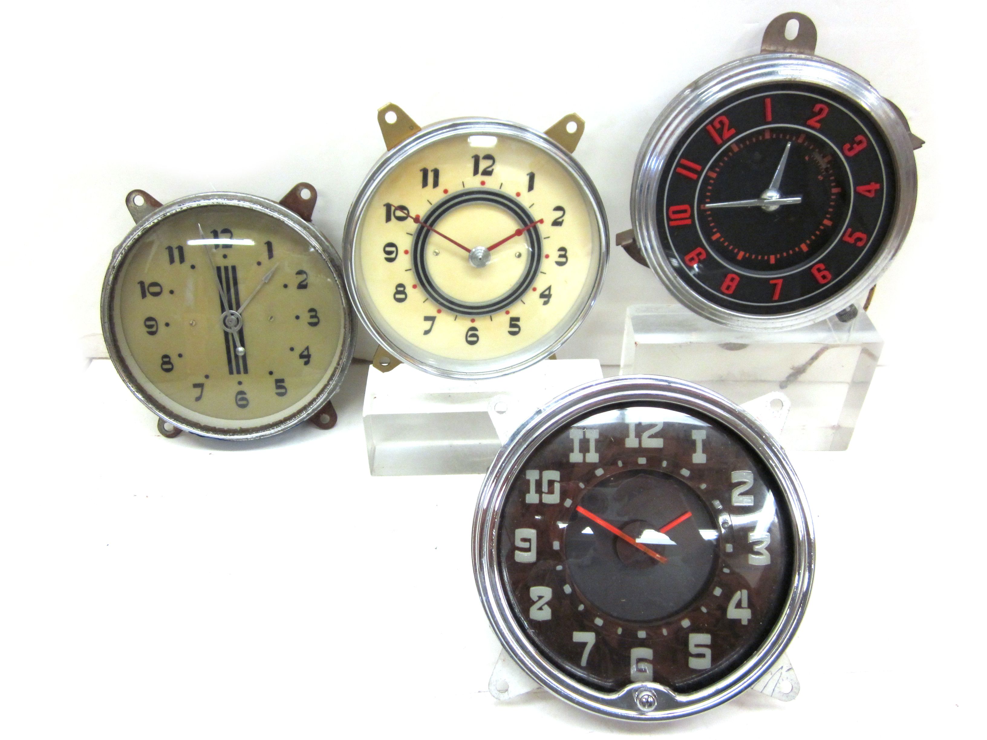 Bonhams Cars : Four antique automotive clocks from the 1930s and 1940s,
