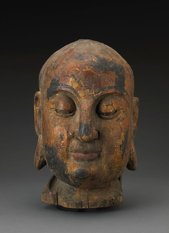 Bonhams : A carved gilt lacquered wood head of an arhat 18th/19th century