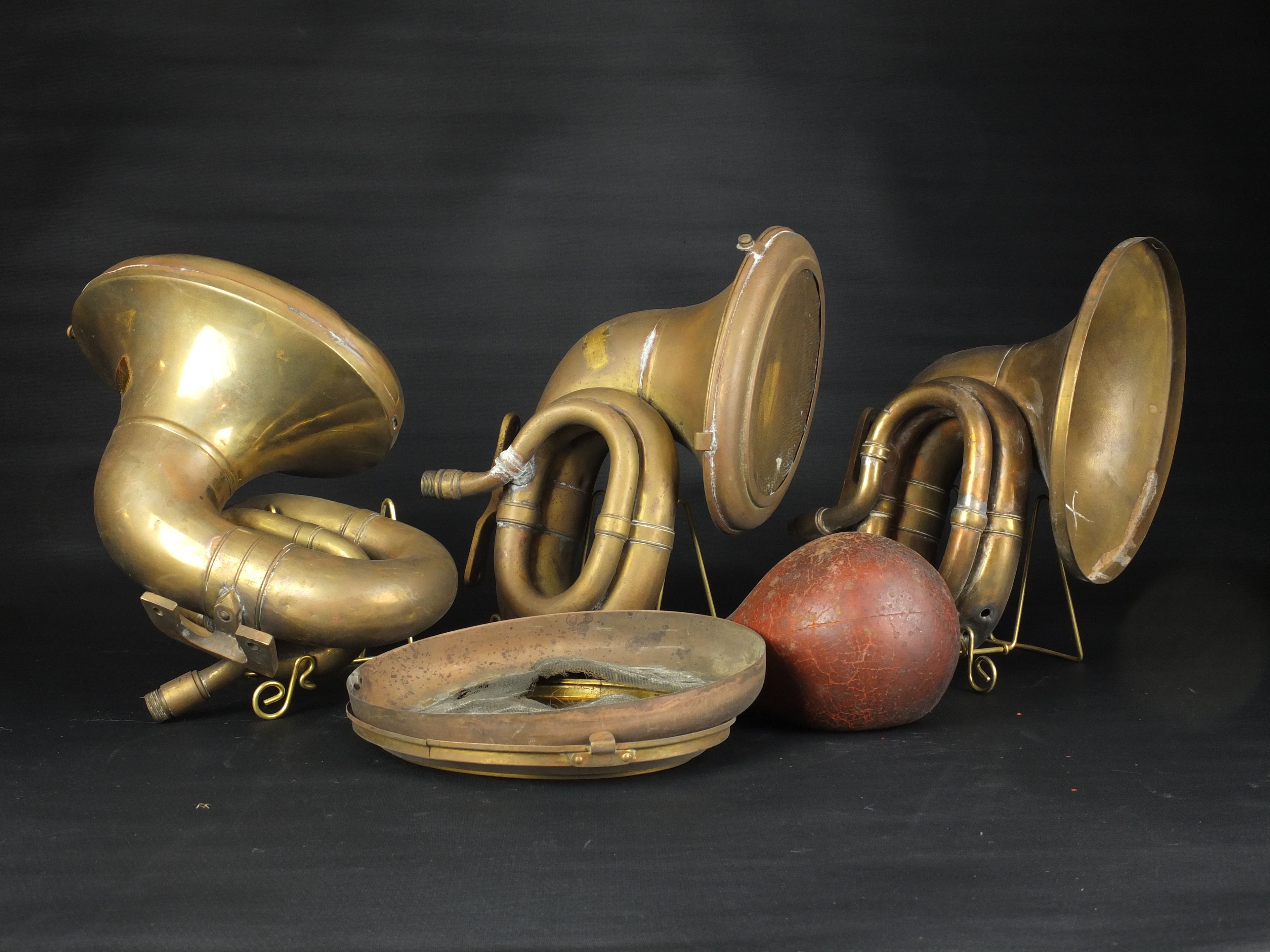 Bonhams Cars : A lot of three brass horns and parts,