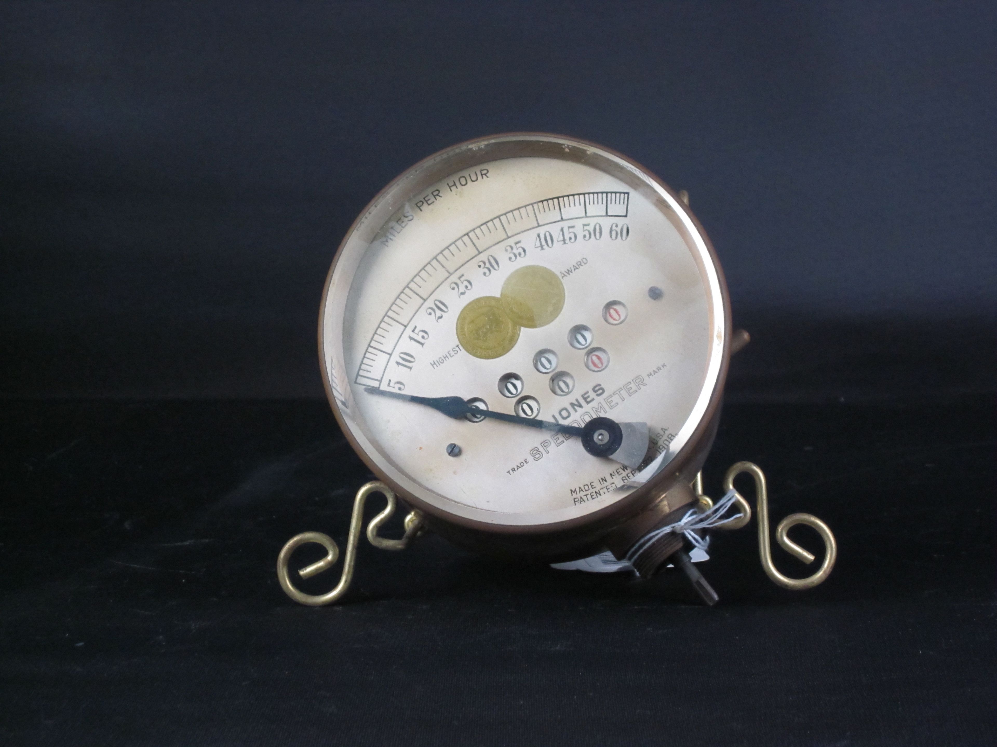 Bonhams Cars : A good large Jones 60mph brass speedometer,