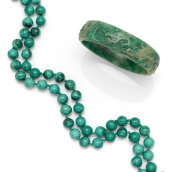 Bonhams : A carved thick jade bangle together with a malachite bead ...