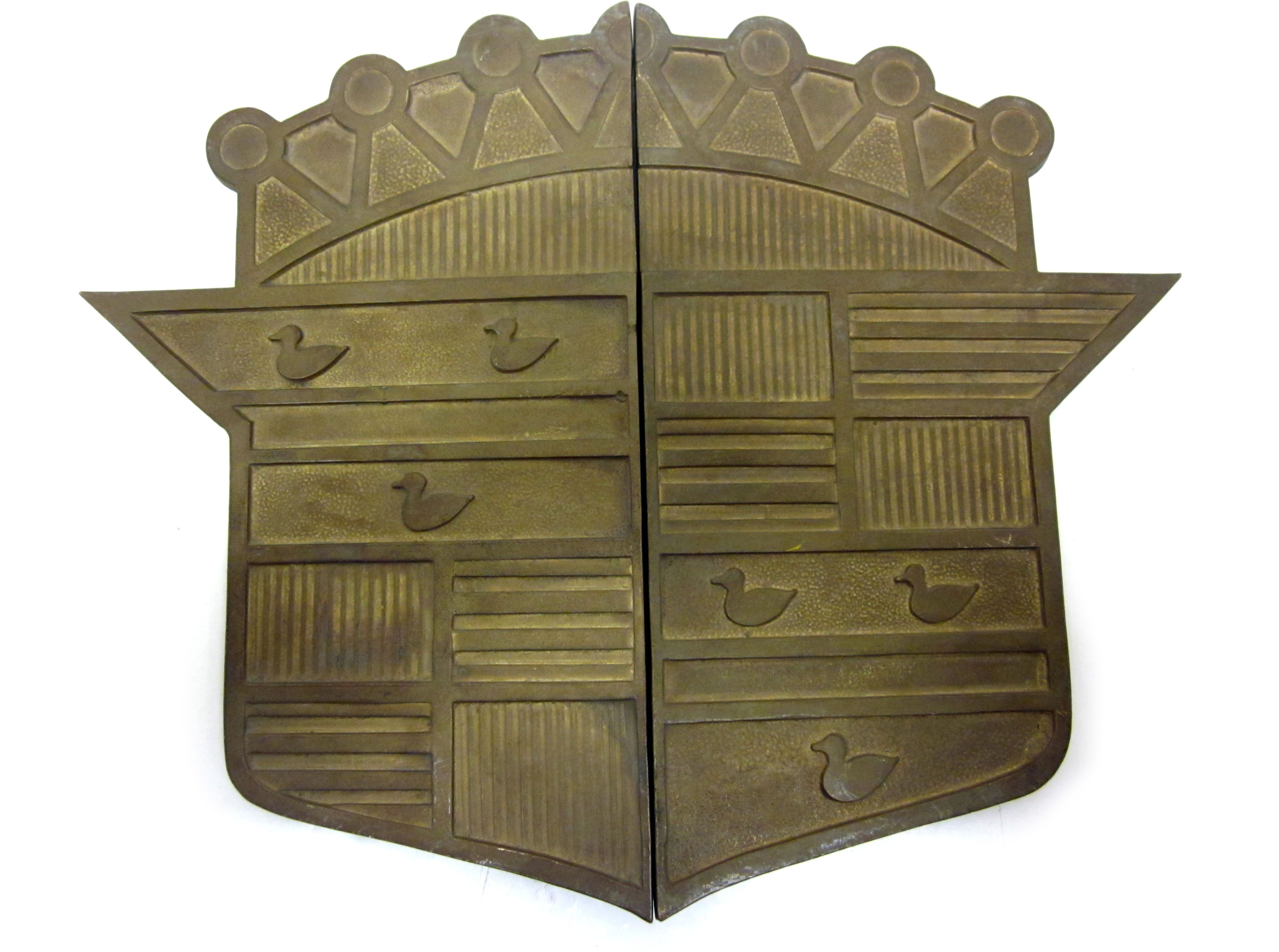 Bonhams Cars : An early bronze cast Cadillac logo,