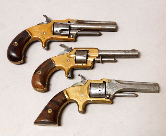Bonhams : A lot of three brass frame spur trigger revolvers
