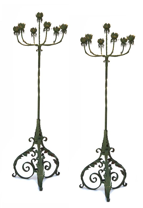 Bonhams : A pair of wrought iron and tôle seven light torchières