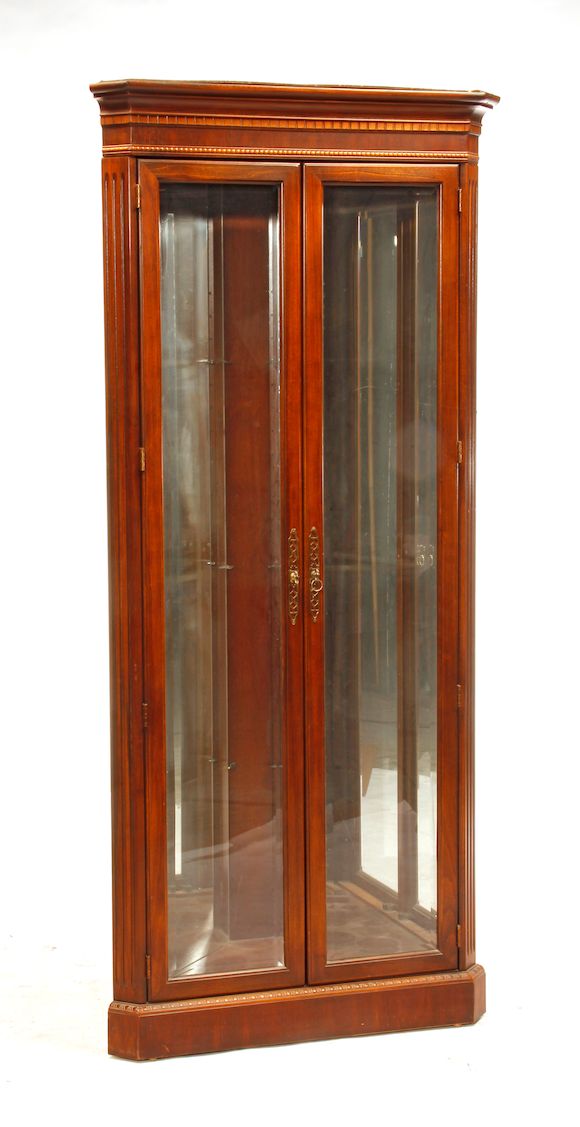 Bonhams : A George III style mixed hardwood vitrine corner cabinet