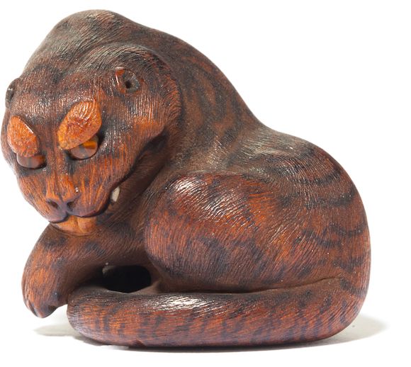 Bonhams : A wood netsuke of a tiger By Tomokazu, Edo period (19th century)