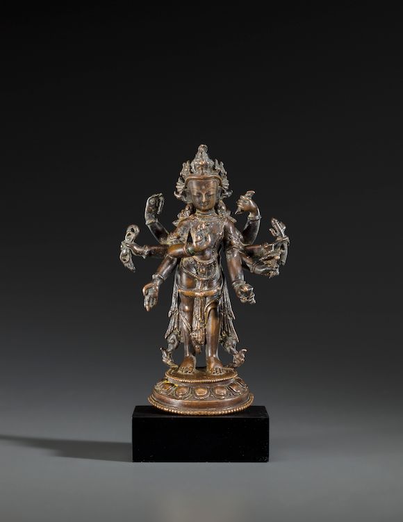 Bonhams : A copper figure of Amoghapasa Nepal, 15th century
