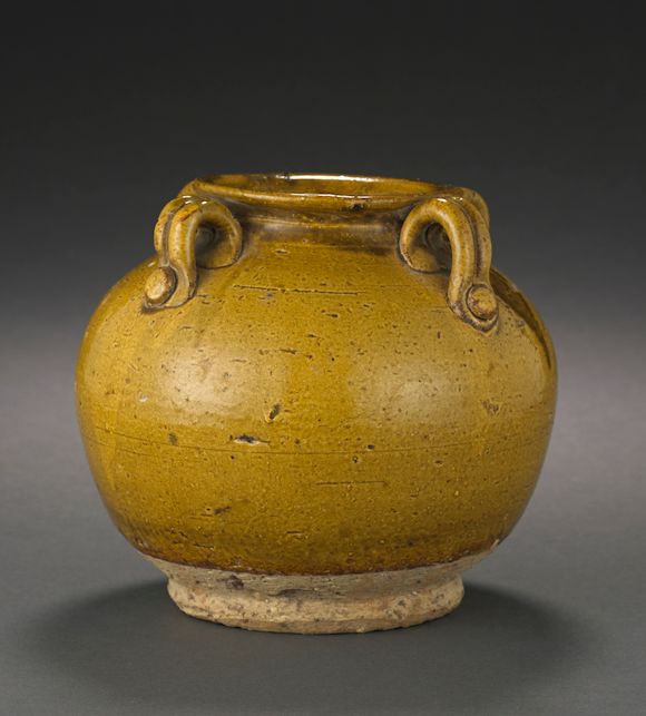 Bonhams : A yellow glazed ceramic jar with lug handles Ming dynasty