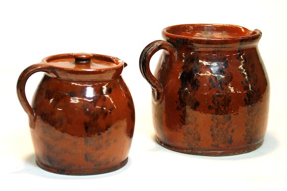 Bonhams : Two glazed redware covered pitchers 19th century