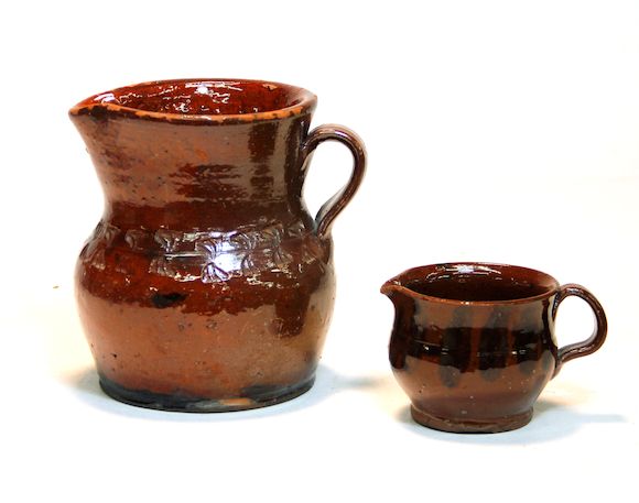 Bonhams : Two glazed redware pitchers 19th century