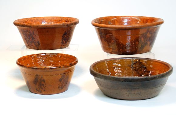 Bonhams : Four glazed redware bowls 19th century