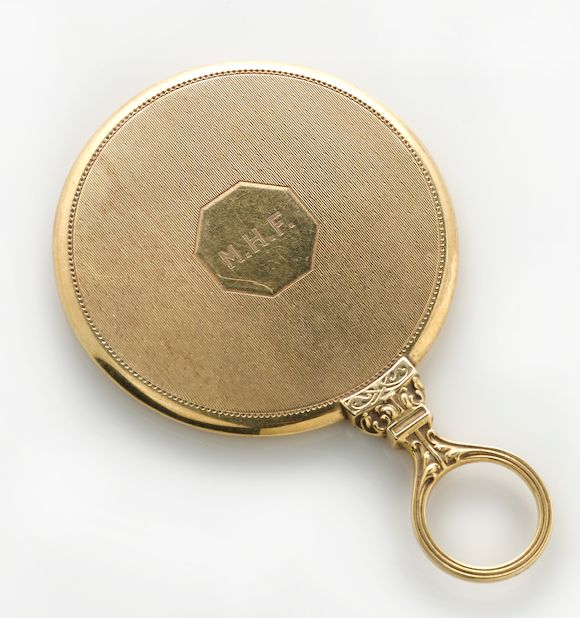 Bonhams : A 14k gold frame hand mirror