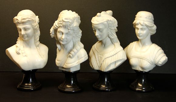 Bonhams : Four white and variegated black marble busts of women
