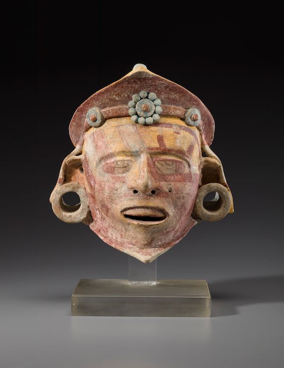 Bonhams : Aztec, Eastern Nahua, Head from a Xantil, ca. A.D. 1300-1521