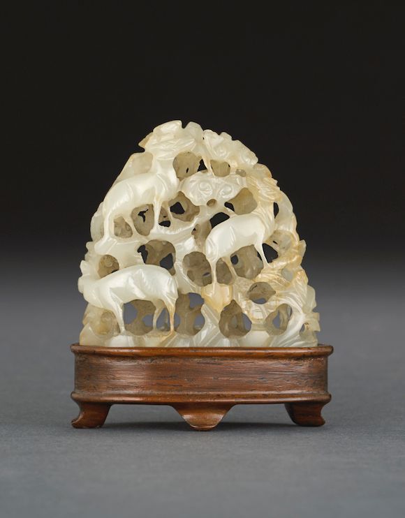Bonhams : A grayish-white jade hat finial Yuan dynasty style