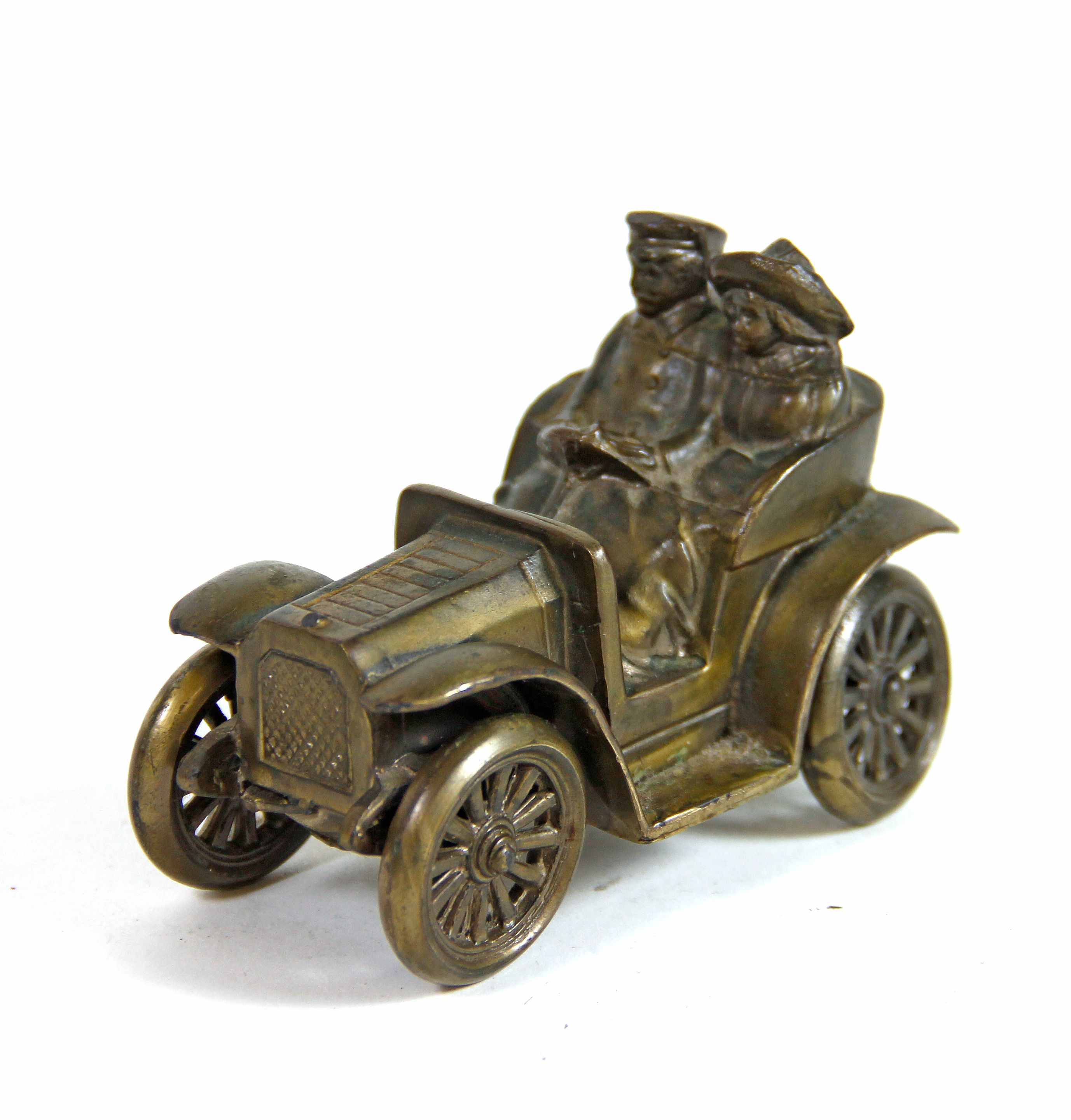 Bonhams Cars : An early touring car paperweight, Approximately 3 ins. long.
