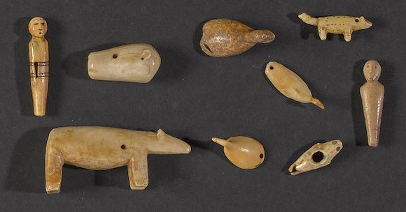 Bonhams : Nine Eskimo human and animal figural sculptures