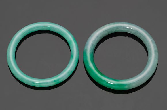 Bonhams : Two green jadeite bangles