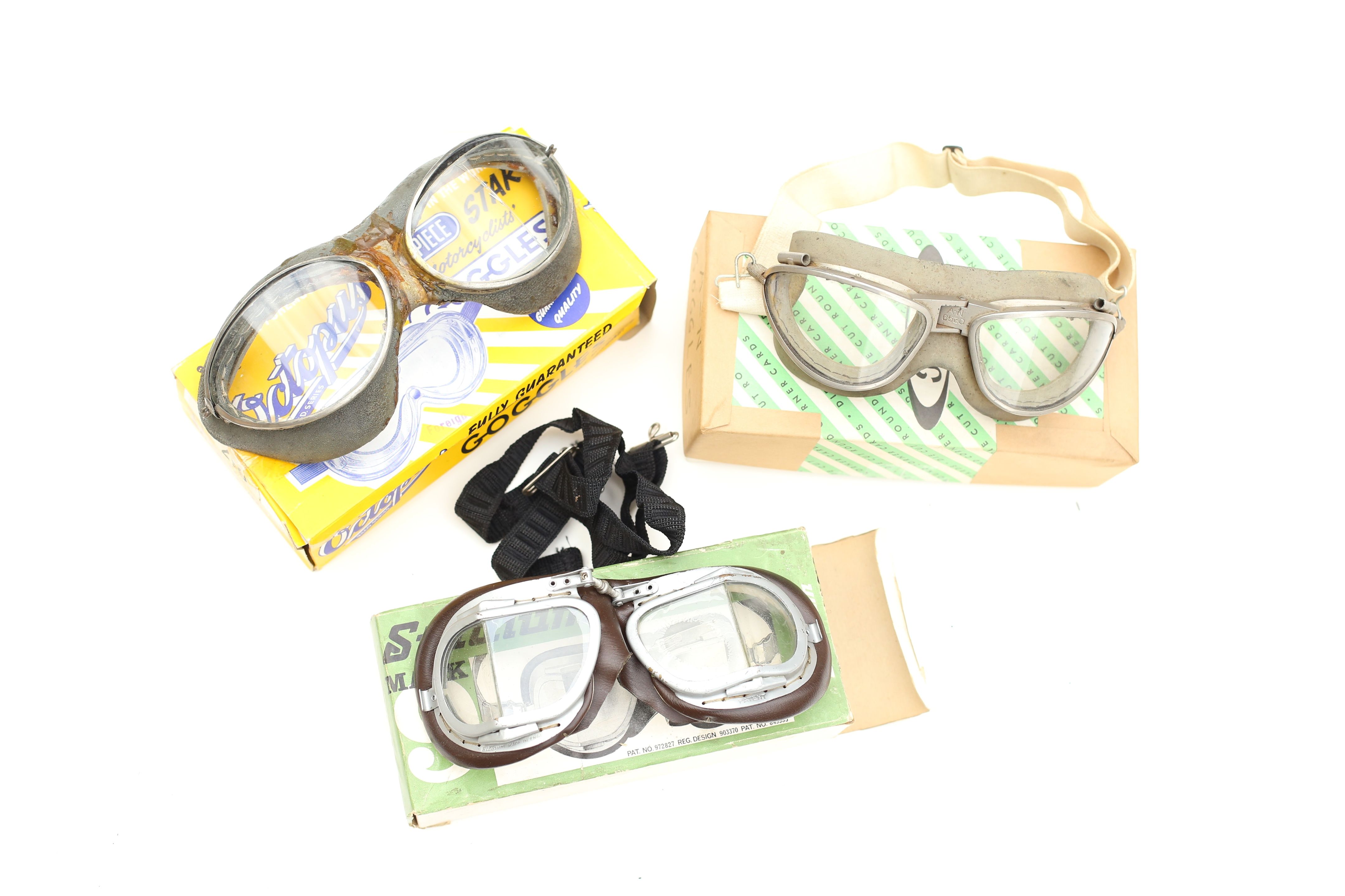 Bonhams Cars : Three pair of vintage goggles with original packaging