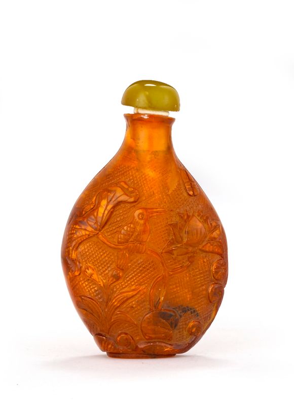 Bonhams : An orange composition snuff bottle imitating amber