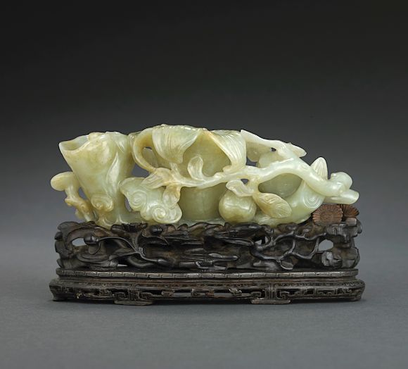 Bonhams : A greenish-gray jade carving of flowers, fruits and lingzhi ...