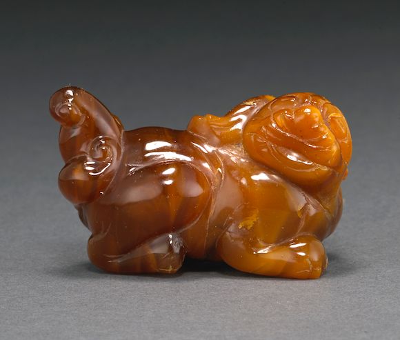 Bonhams : A carved root amber beast
