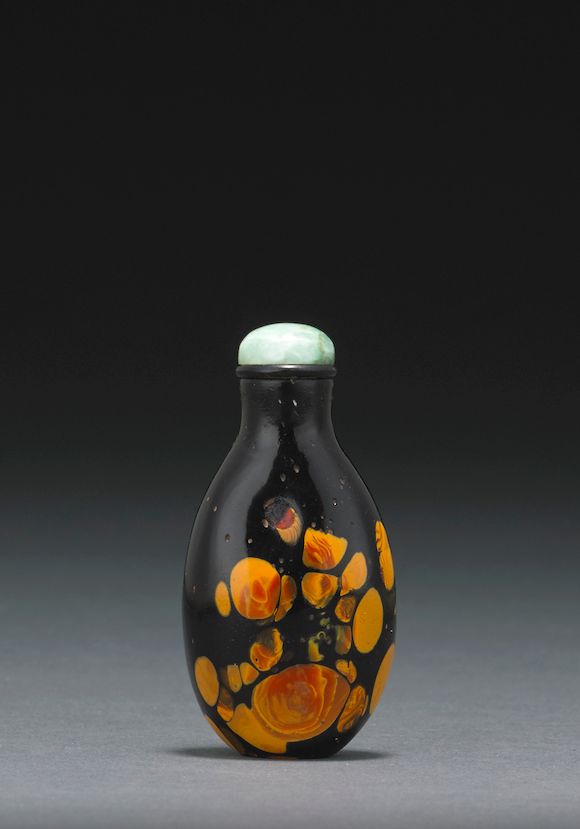 Bonhams : An orange-splashed black glass snuff bottle