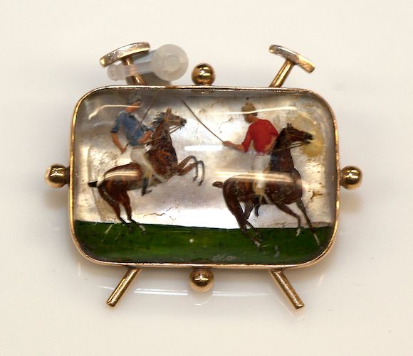 Bonhams : A reverse painted crystal and 14k gold "polo game" motif brooch,