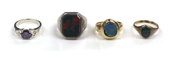 Bonhams : A collection of four opal doublet, bloodstone, purple stone ...
