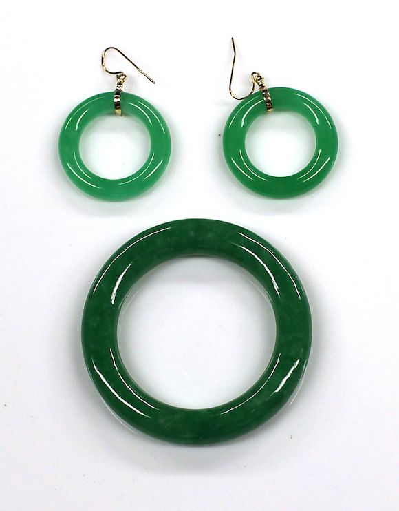 Bonhams : A pair of jadeite jade and 14k gold circle earrings together with a jadeite jade baby ...