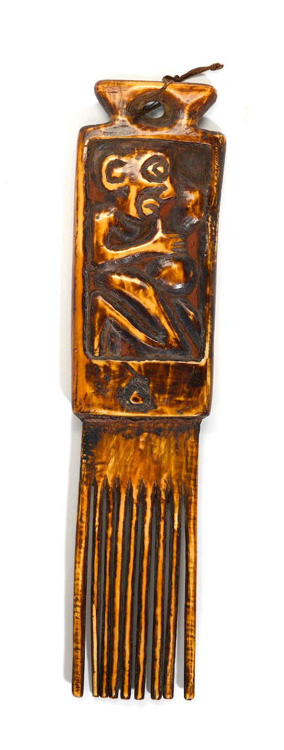 Bonhams : An African carved ivory comb