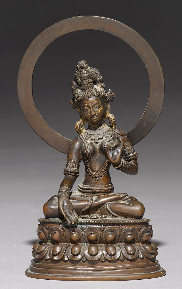 Bonhams : A copper alloy figure of Tara