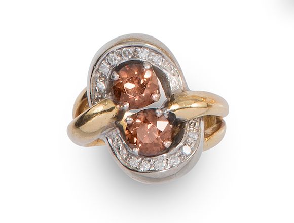 Bonhams : A colored diamond, diamond and 18k bi-color gold ring