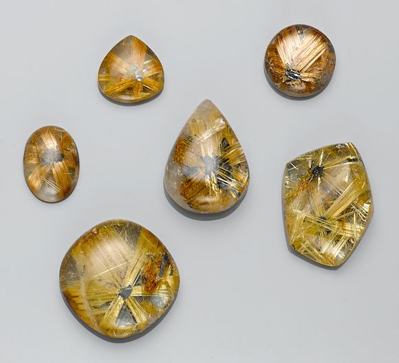 Bonhams : Group of Six Quartz Cabochons with Six-Rayed Rutiles ...