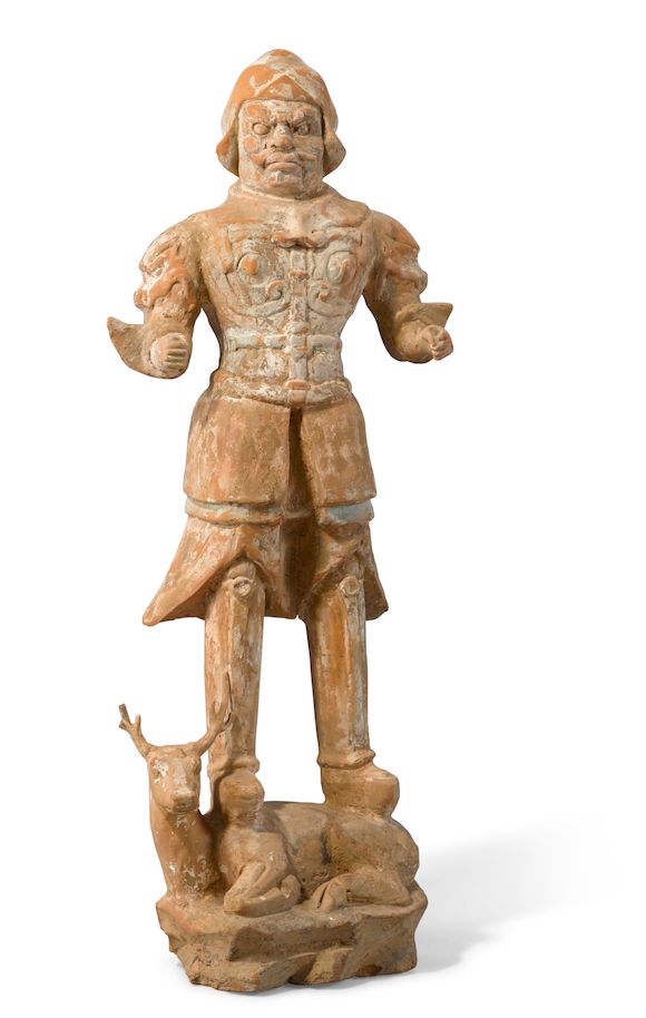 Bonhams : A painted pottery figure of a lokapala standing on a deer ...