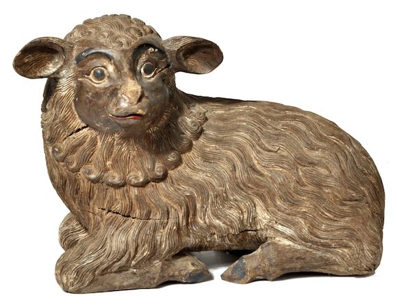 Bonhams : A carved and painted wooden figure of a recumbent sheep