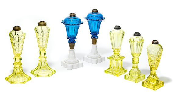 Bonhams : A group of five American vaseline color flint glass oil lamps ...