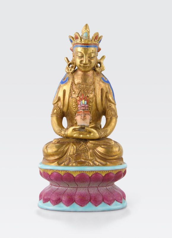 Bonhams : A gilt and polychrome enameled porcelain seated figure of ...