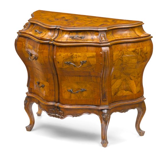 Bonhams : An Italian Rococo style walnut chest of bombé outline 20th ...