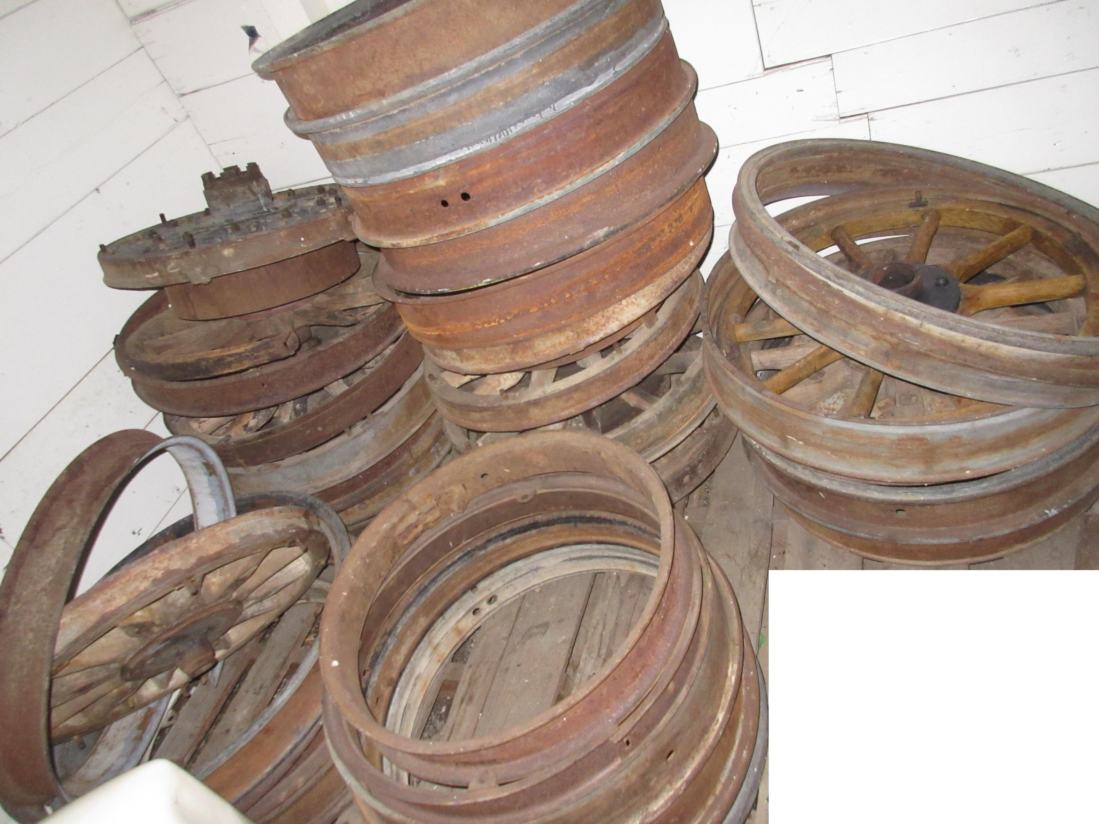 Bonhams Cars : Assorted artillery wheels and steel wheel rims,